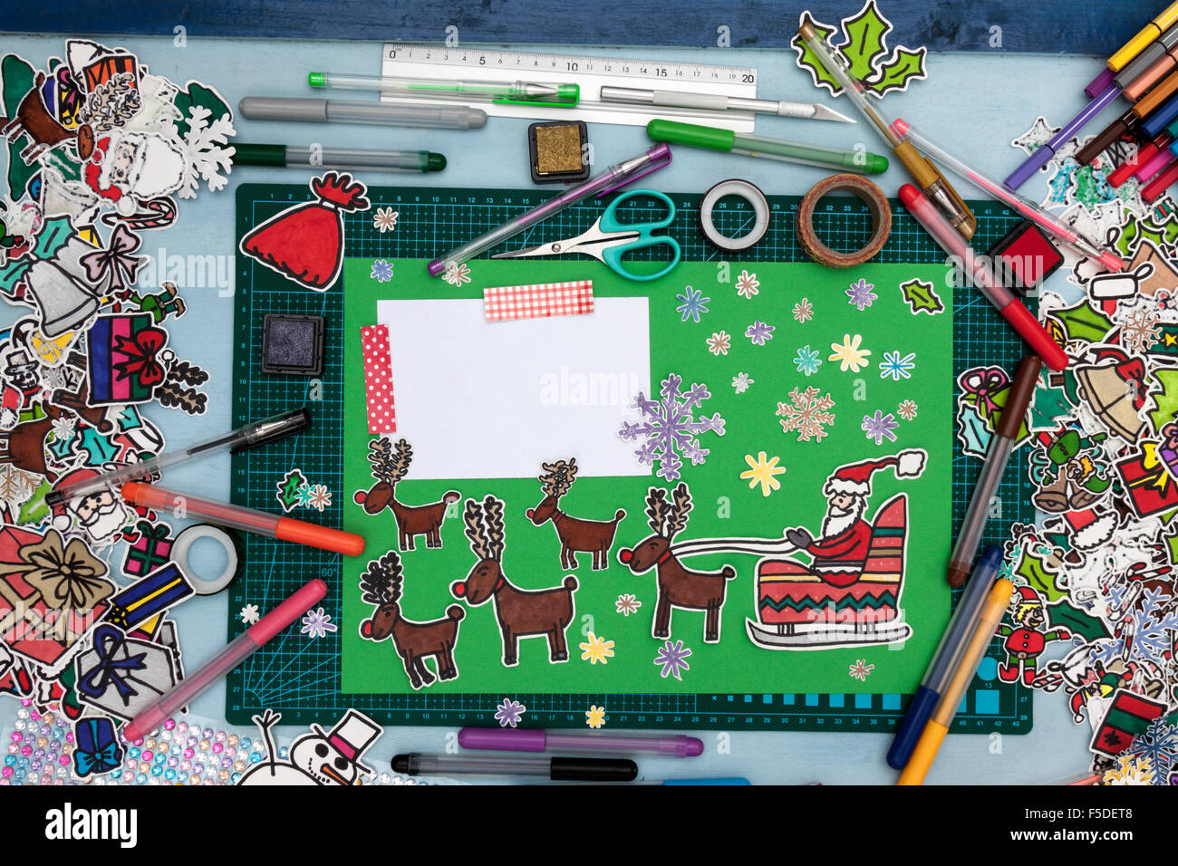 a horizontal overhead view of a scrapbook xmas layout with some of the ...