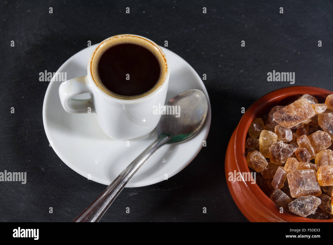 German Rock Sugar, brauner Kandis in a terracotta brown bowl with cup ...
