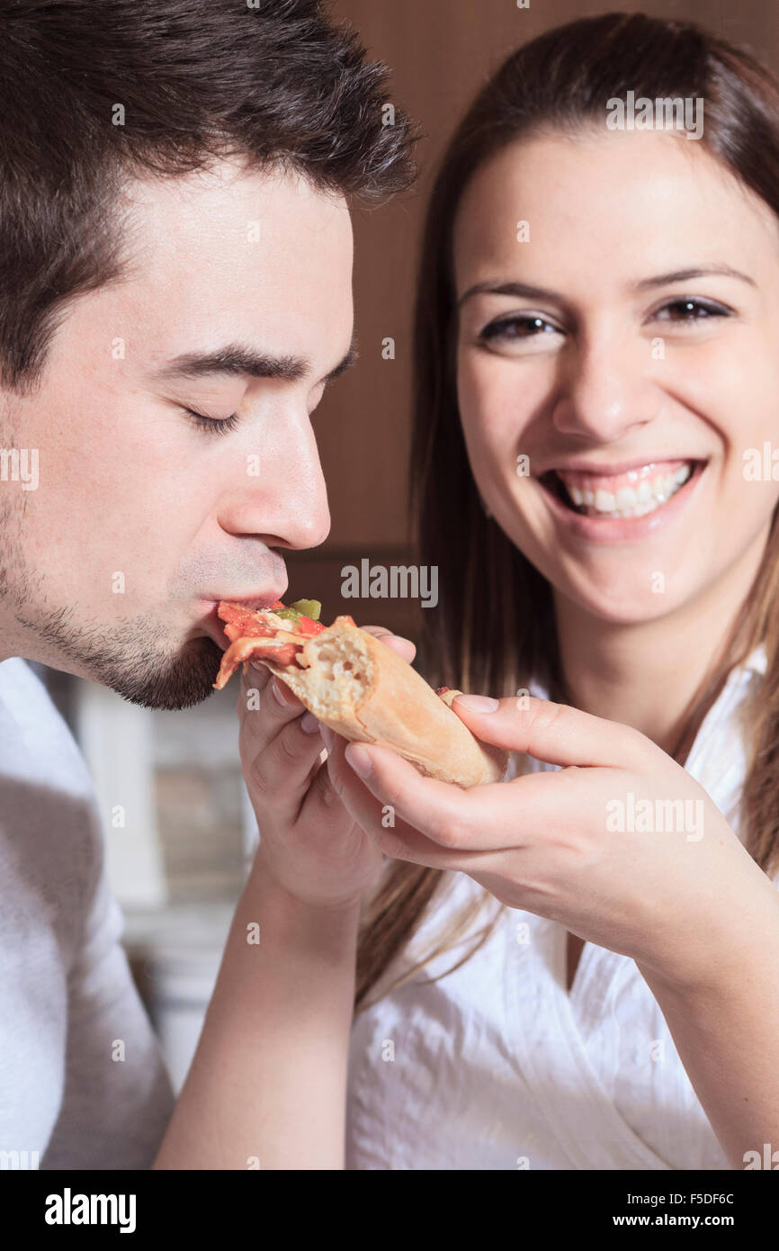 Young woman eating pizza model hi-res stock photography and images - Alamy
