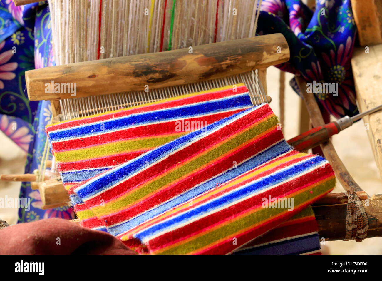 Traditional old wooden handloom ready for weaving in the courtyard of a ...