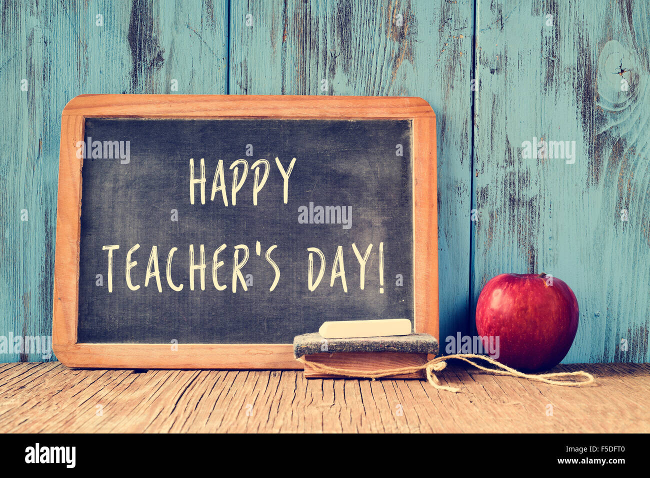 a chalkboard with the text happy teachers day written in it, a piece of ...