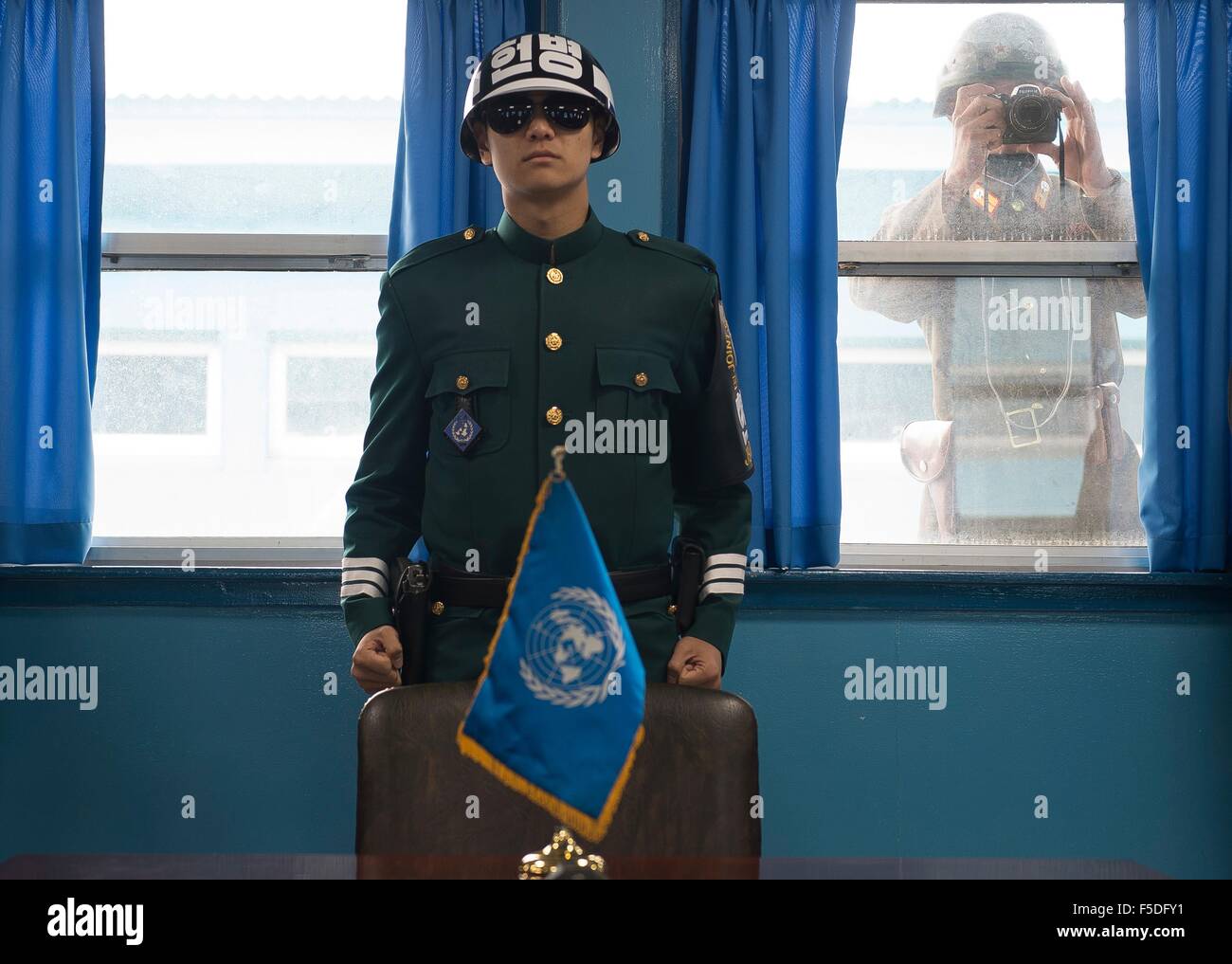 A South Korean Army soldiers guards the Korean Demilitarized Zone as a ...