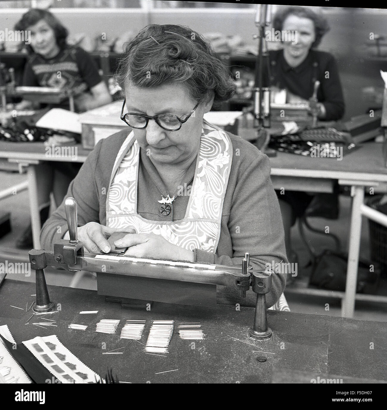 1950s historical, elderly lady working on factory production line Stock ...