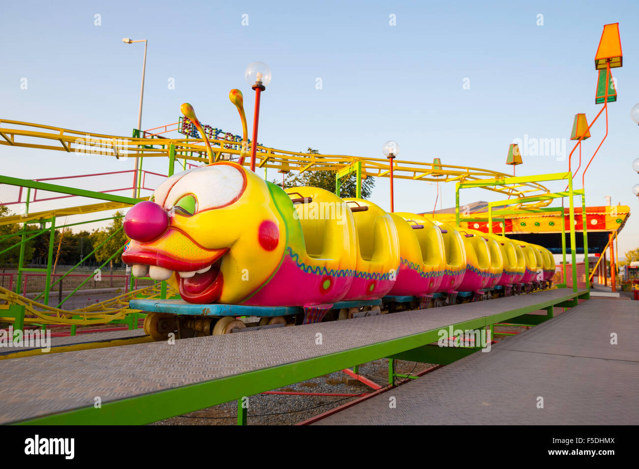 Caterpillar train for entertainment on a fun fair amusement park Stock ...