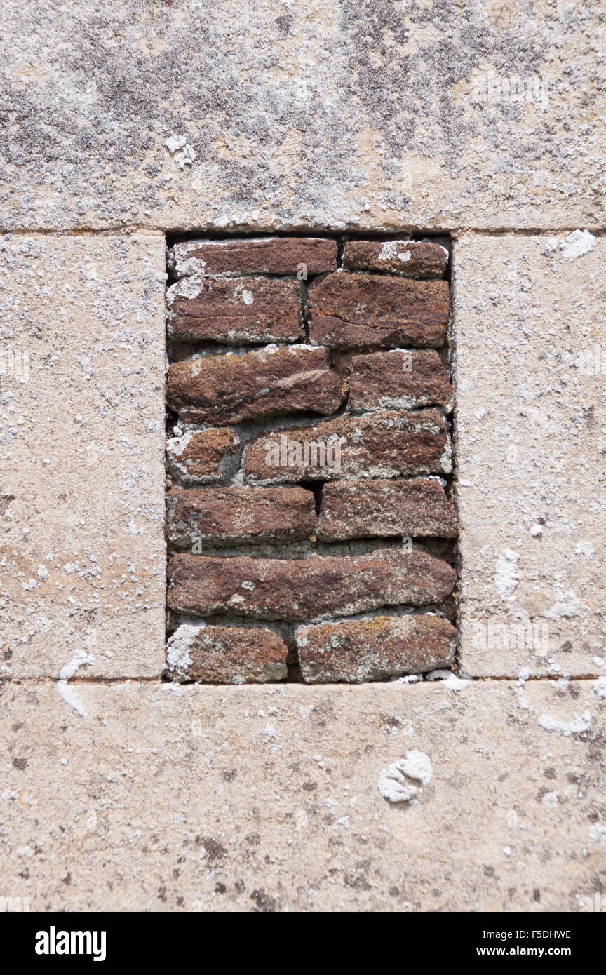elegant old carrstone wall with contrasting textures, colours and ...