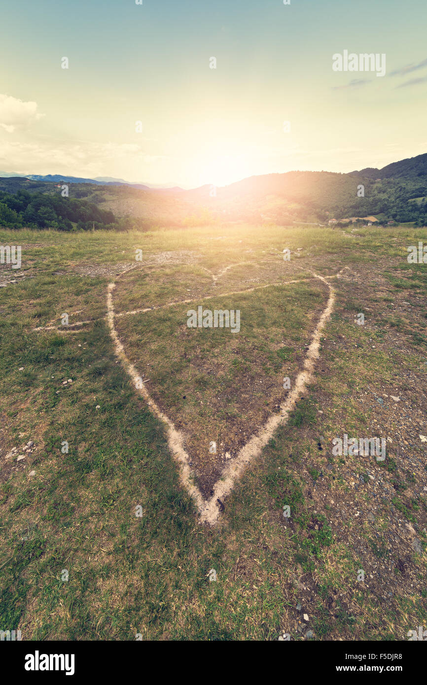 Heart shape on field with sand border Stock Photo - Alamy