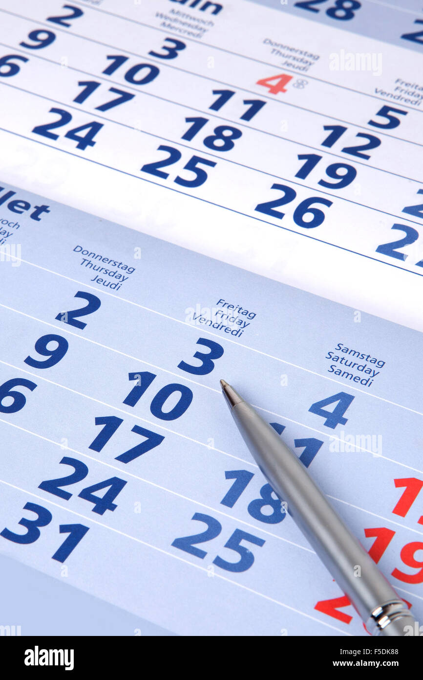 Calendar with pen Stock Photo - Alamy