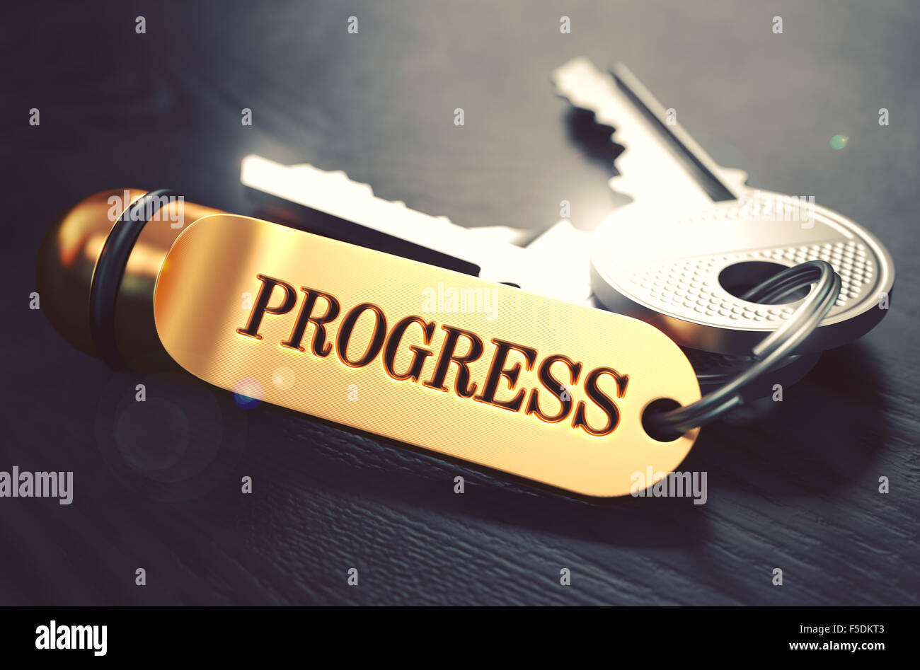 Progress - Bunch of Keys with Text on Golden Keychain Stock Photo - Alamy