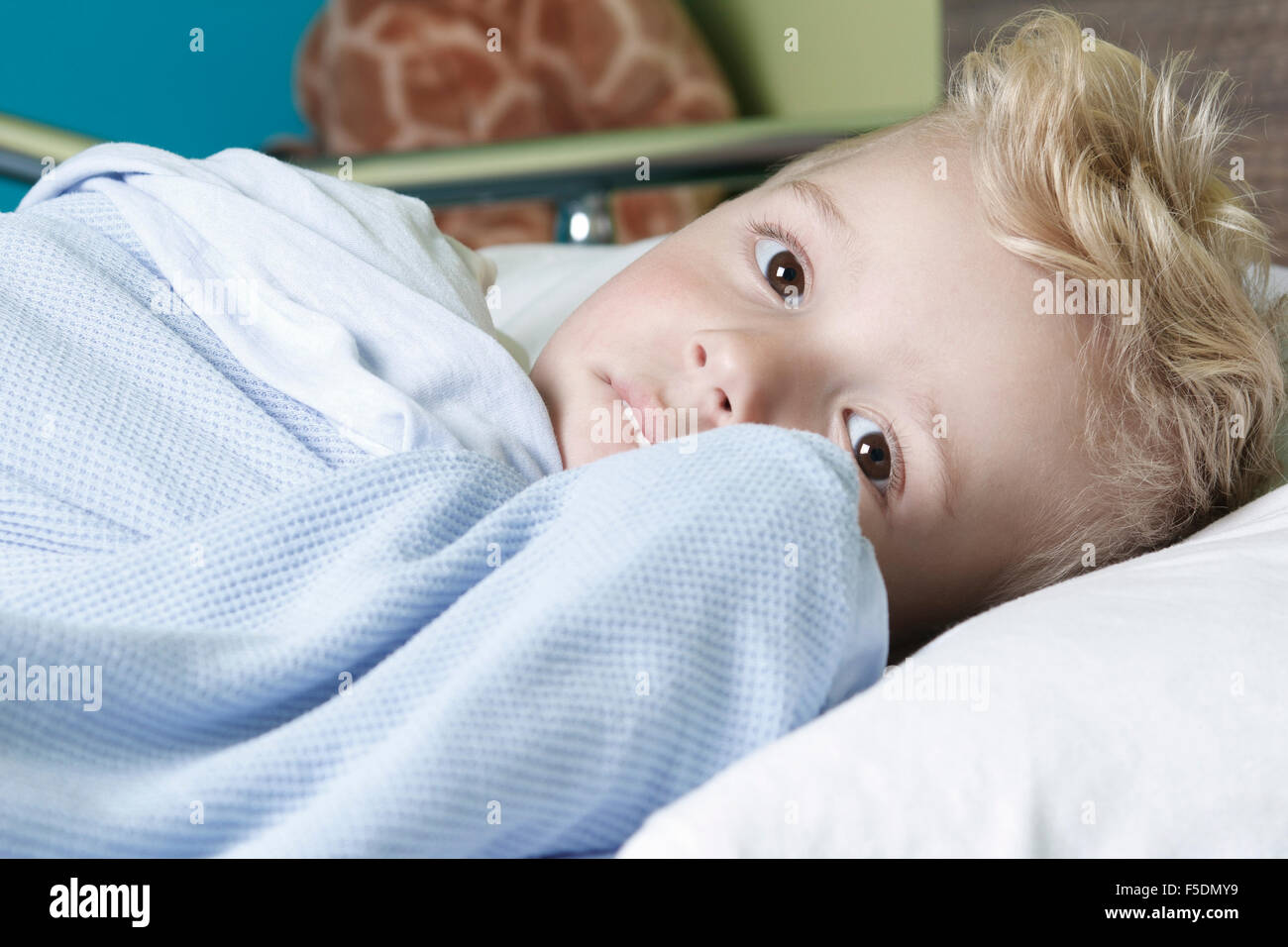 sick little boy in a hospital bed Stock Photo - Alamy