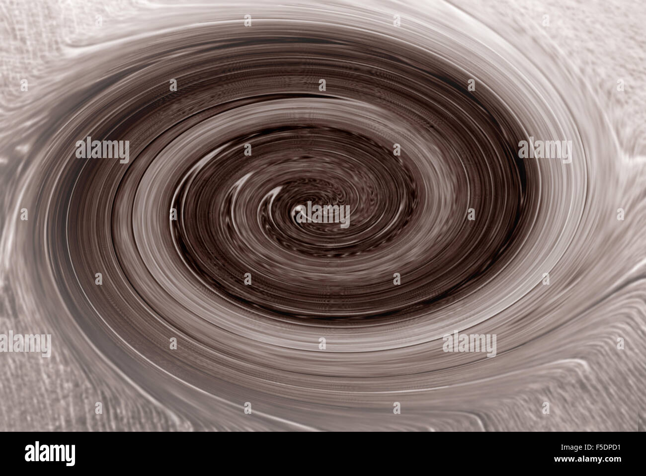 a chocolate colored swirl going round Stock Photo - Alamy