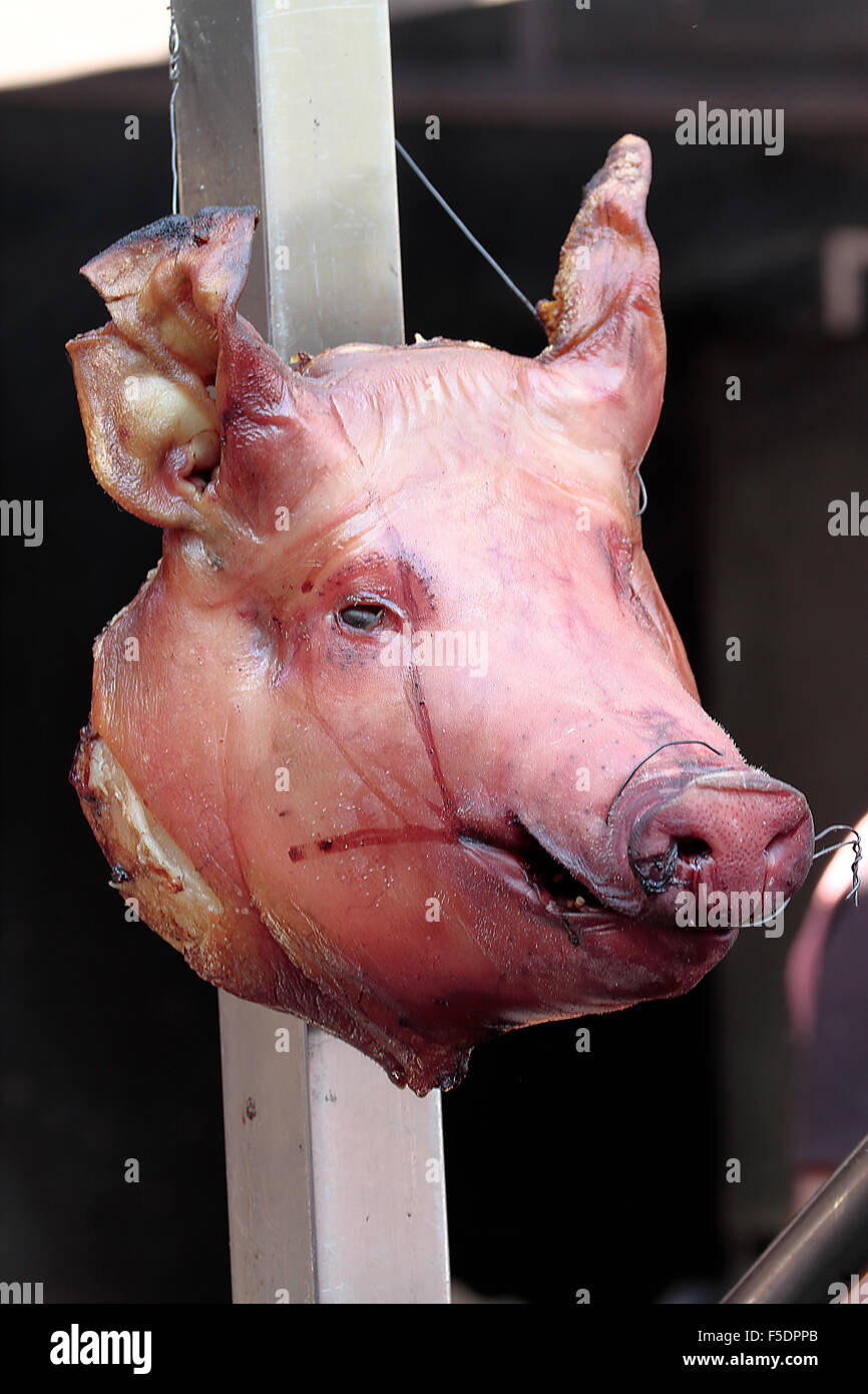 photograph of the head of a pork roast on the grill Stock Photo - Alamy