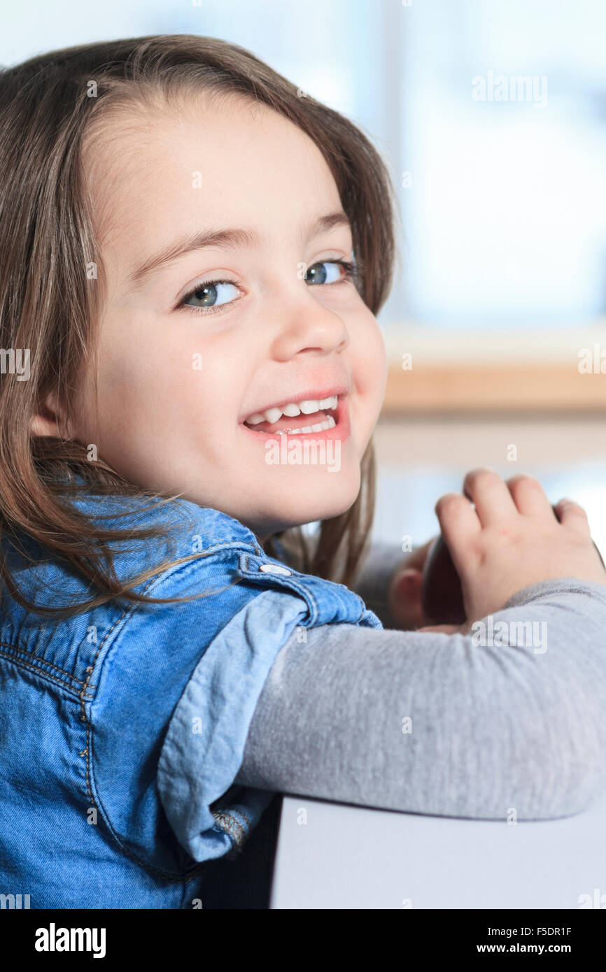 children girl at kitchen with apple Stock Photo - Alamy