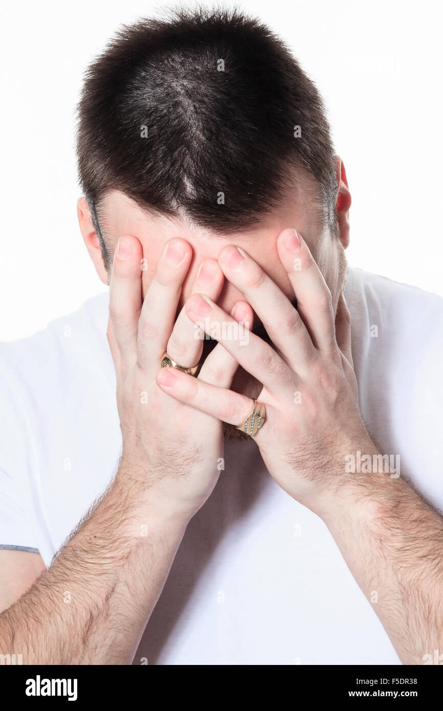 A man having a disturbing problem over white Stock Photo - Alamy