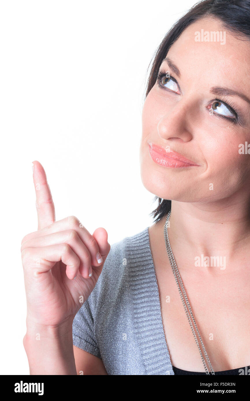 As adult woman pointing in studio white background Stock Photo - Alamy