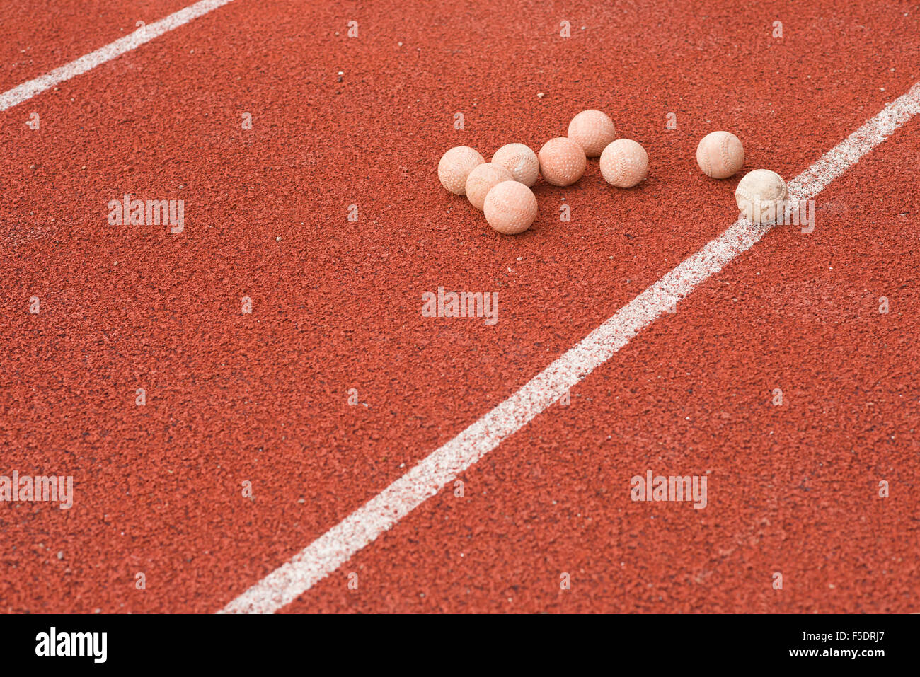 baseballs on rubber runway Stock Photo - Alamy