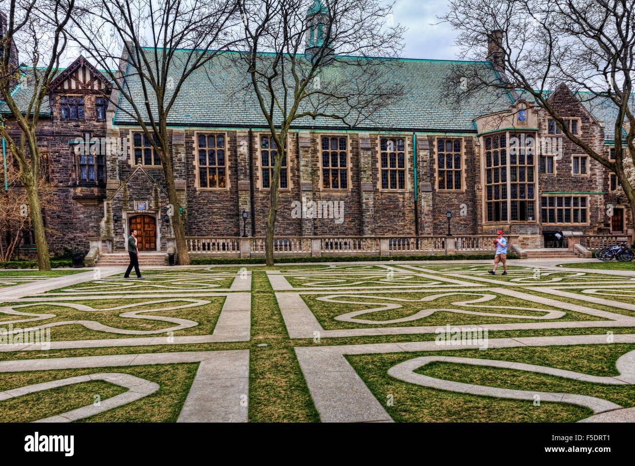Two students play football in the commons area of Trinity College in ...