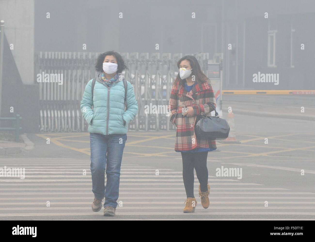 Harbin, China's Heilongjiang Province. 3rd Nov, 2015. People walk in ...