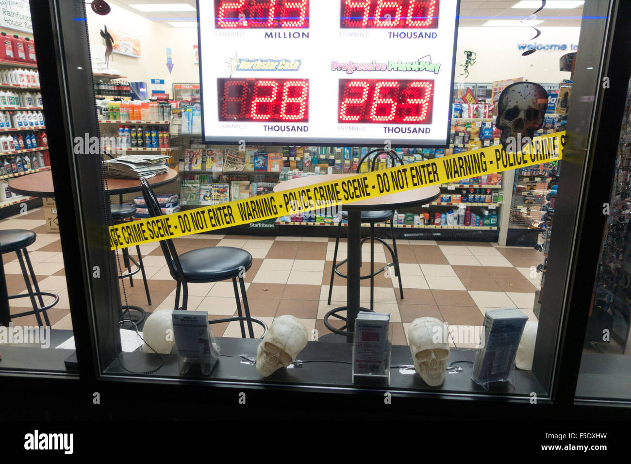 Window of gas station convenience store with Halloween police Crime ...