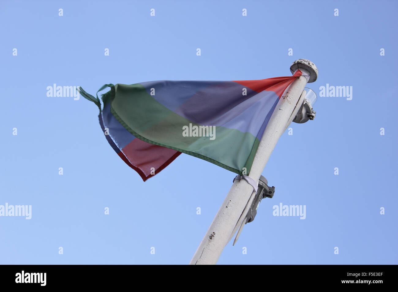 Flag in the wind against the sky Stock Photo - Alamy