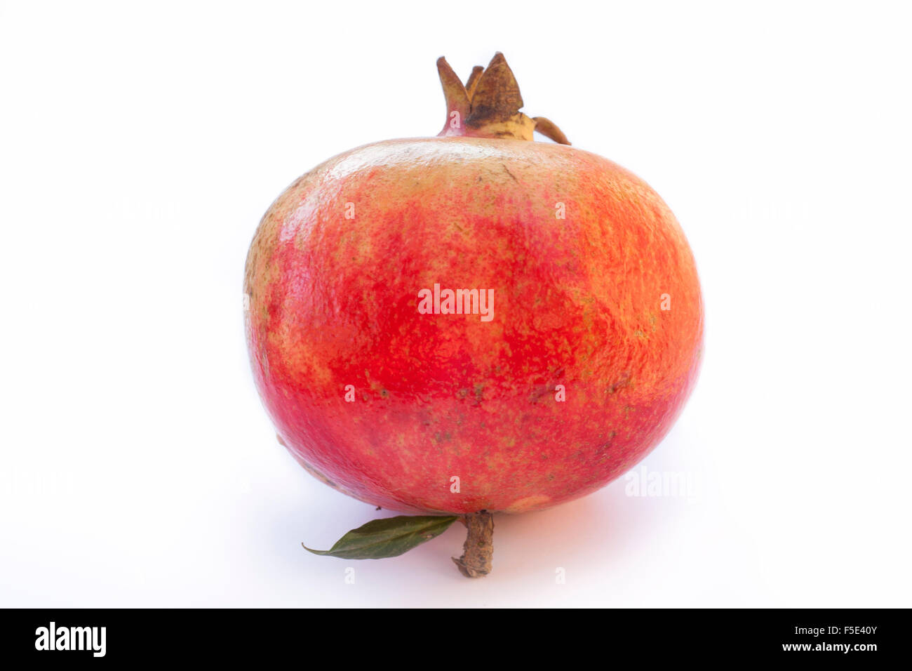 Single Pomegranate Isolated On White, closeup Stock Photo - Alamy