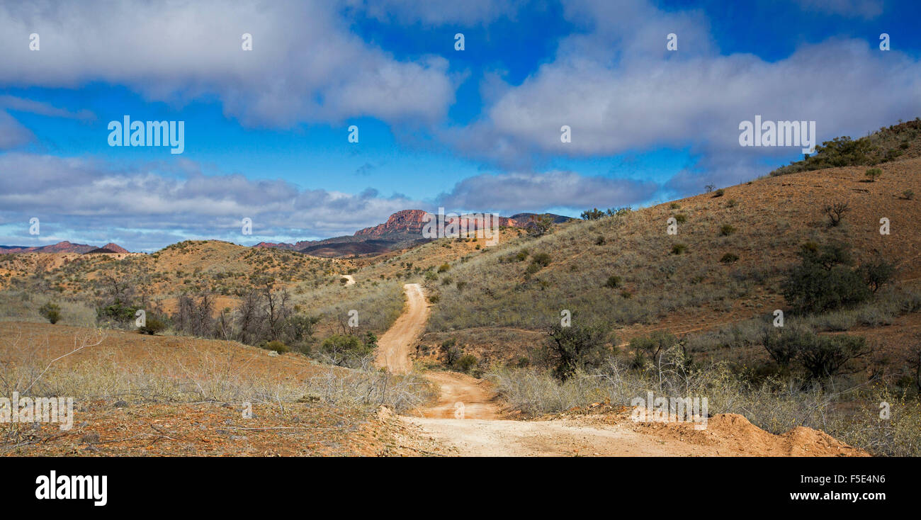 Panoramic view of winding road snaking across barren hilly landscape of ...