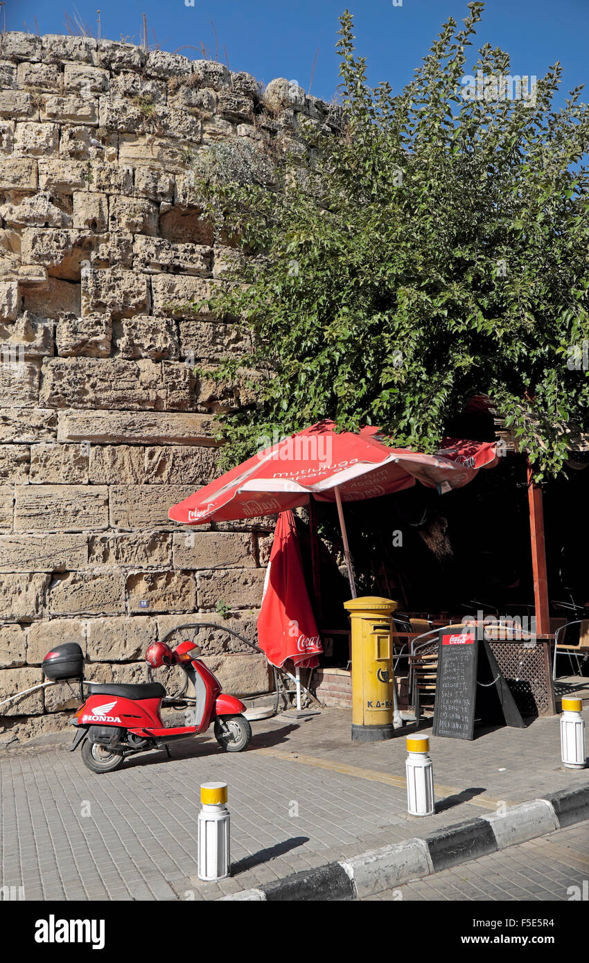 Moped, Umbrella and yellow Cypriot post box in a street in Kyrenia ...
