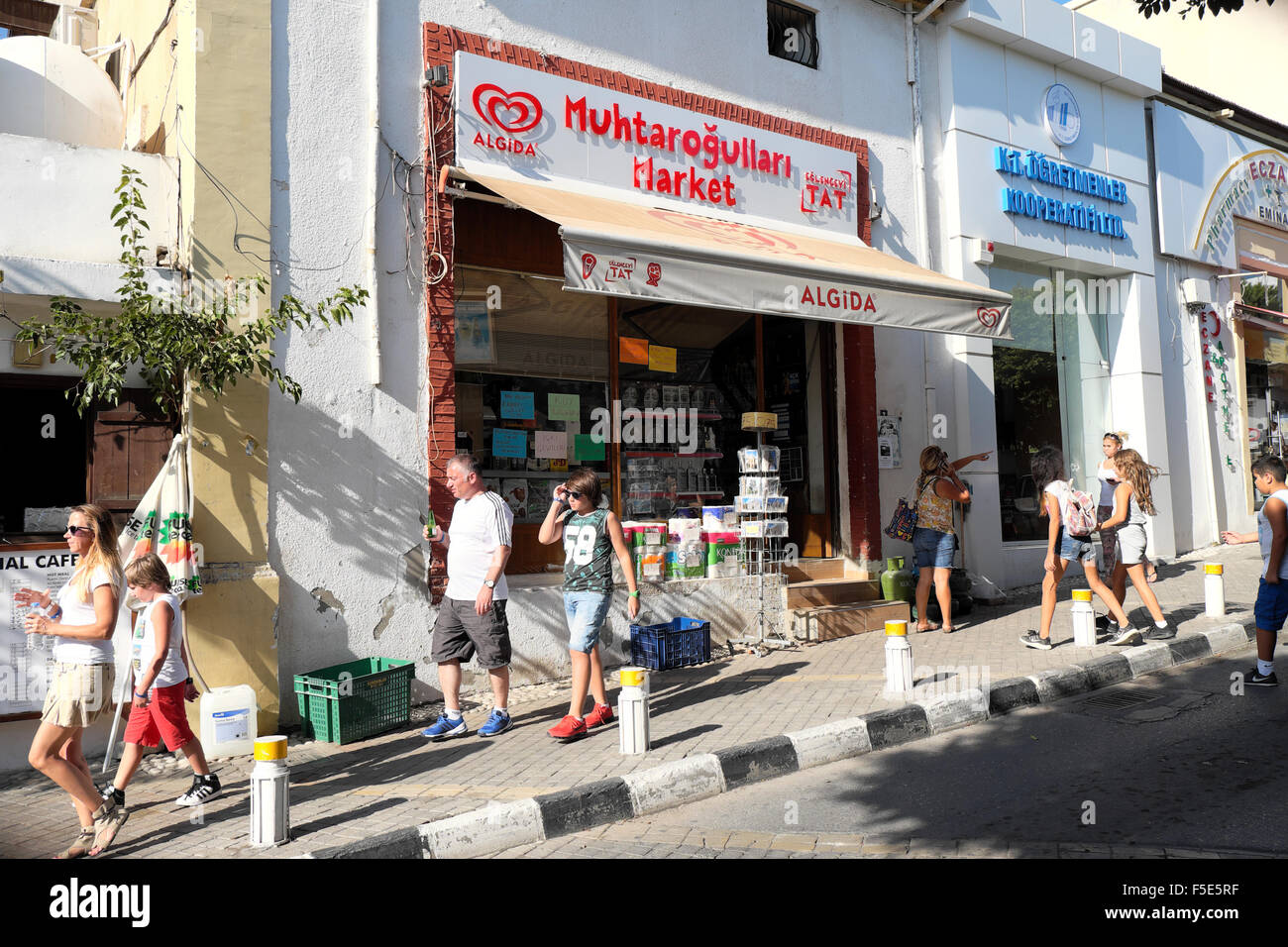 Tourists shopping walking along the street outside Muhtaroguliari ...