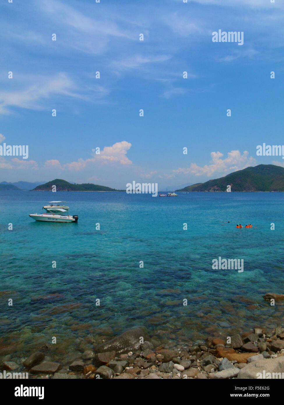 Small boat at sea on clear water in Nha Trang, Vietnam Stock Photo - Alamy