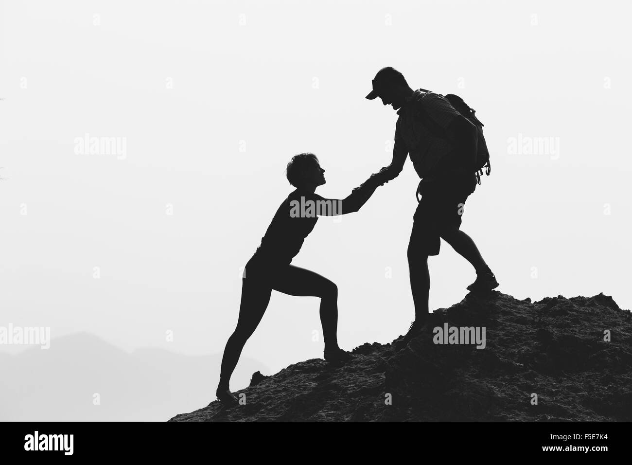 Black Person Helping Someone Up