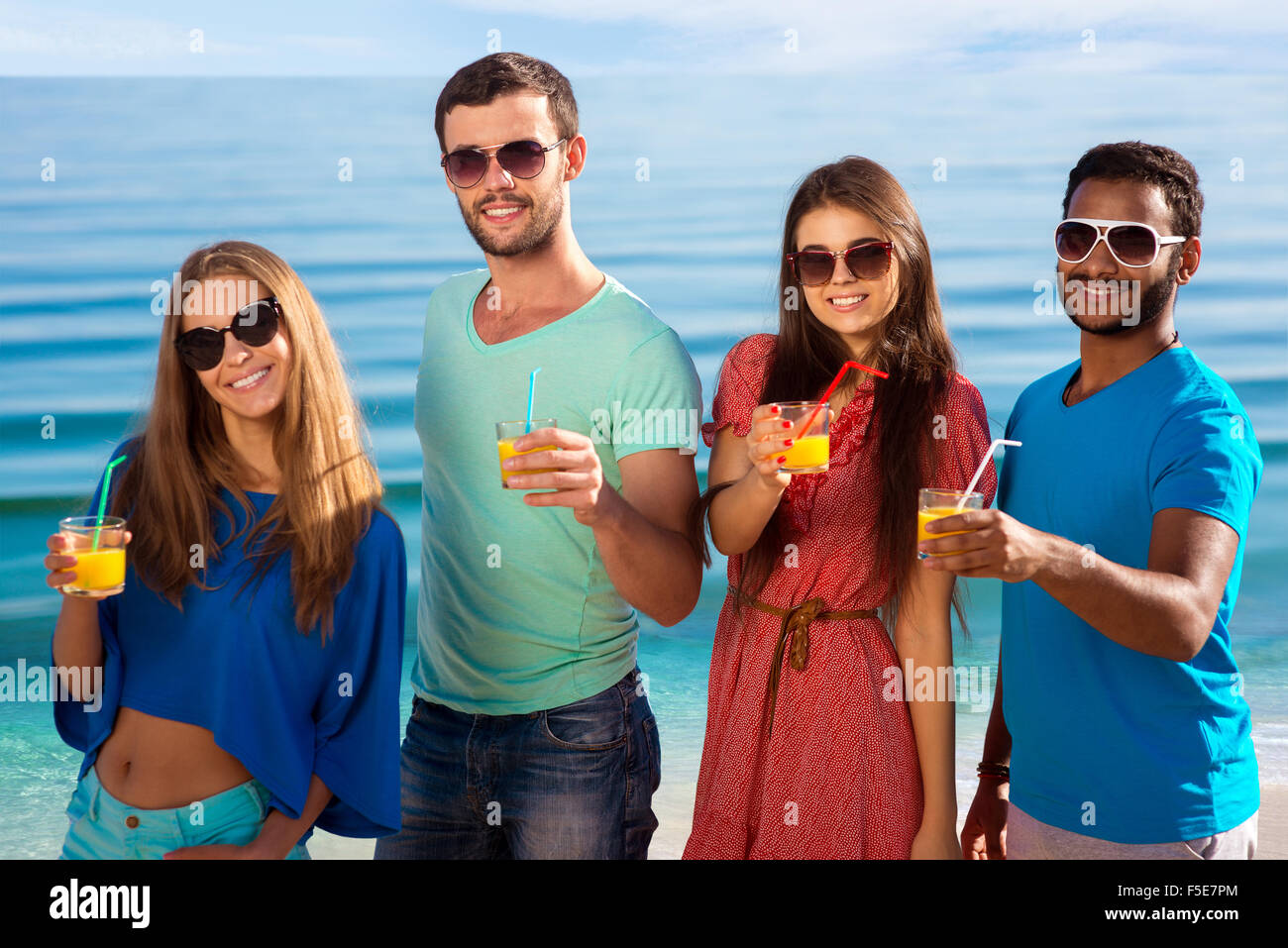 Friends relaxing in the seaside resort Stock Photo - Alamy