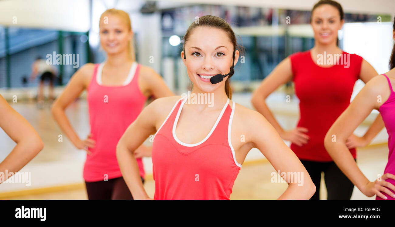 group of smiling people exercising in the gym Stock Photo - Alamy