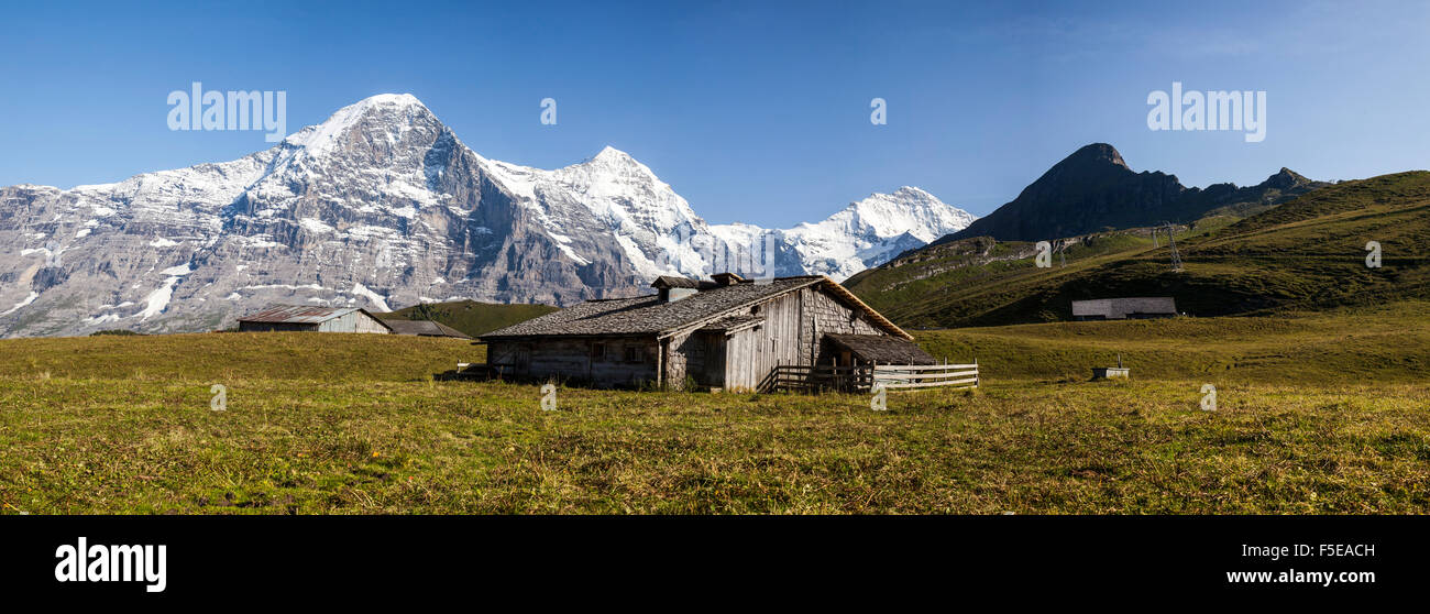 Panoramic view of wood hut with Mount Eiger in the background ...