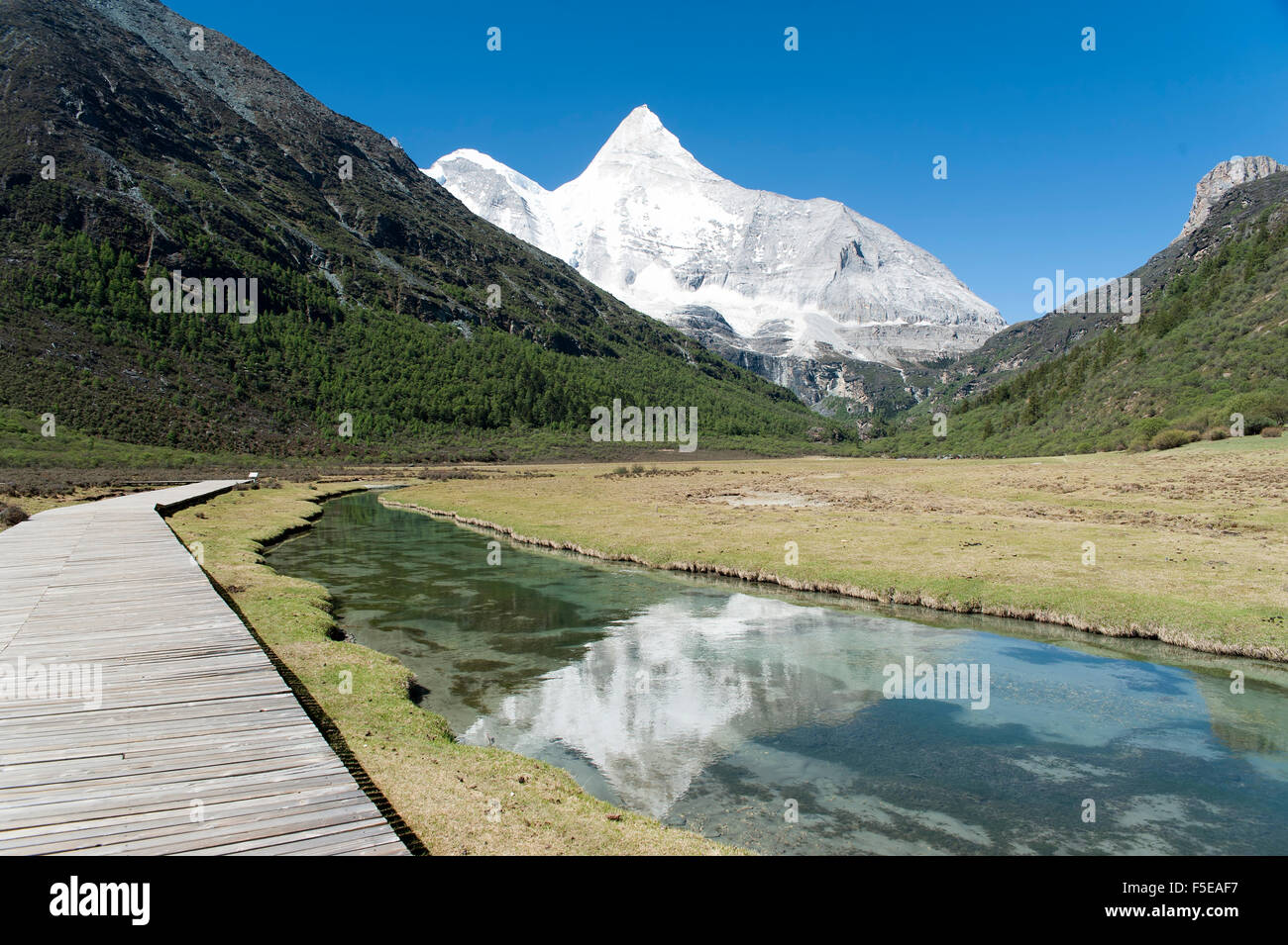 Tibet snow mountain with river in China Stock Photo - Alamy