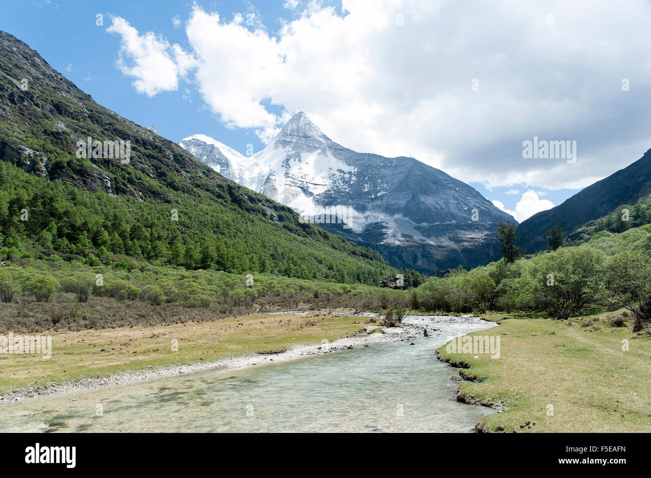 Tibet snow mountain with river in China Stock Photo - Alamy