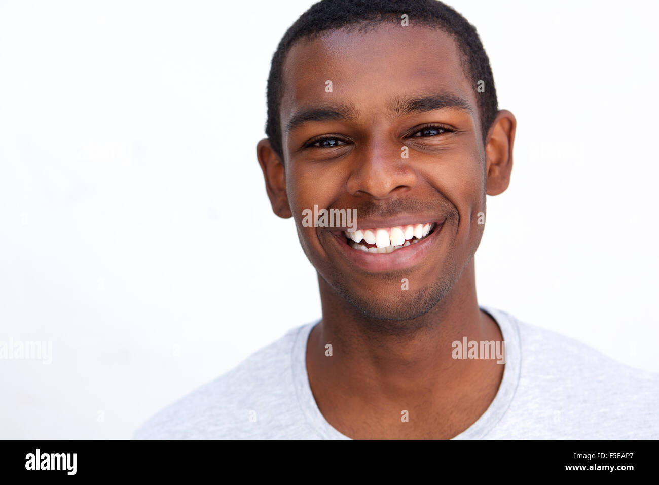 Close up portrait of a smiling african american man posing against ...