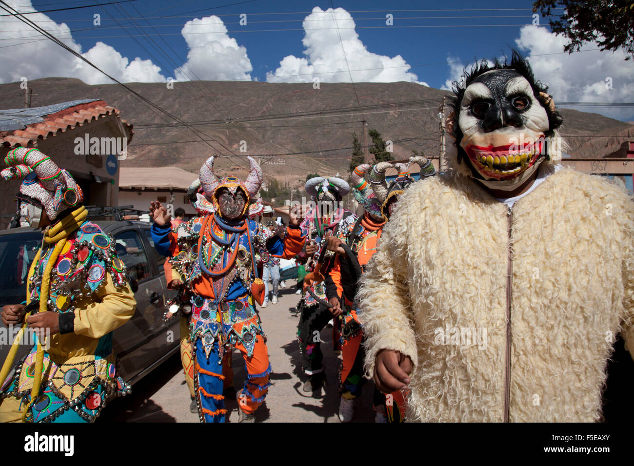 Revellers in costumes and masks at Humahuaca carnival in Jujuy province ...