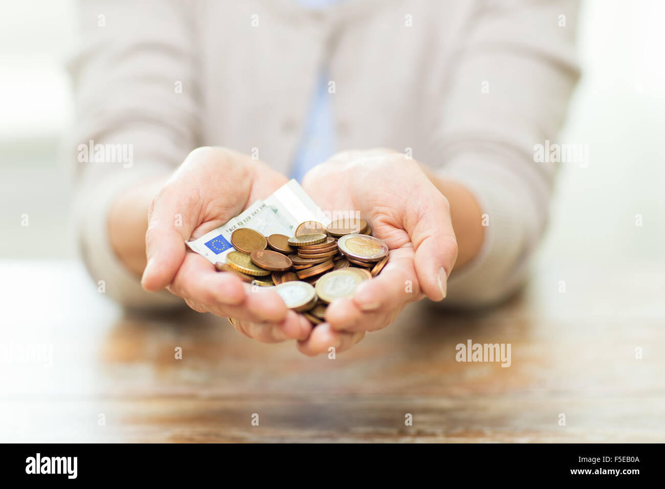 Mature woman showing money hi-res stock photography and images - Alamy