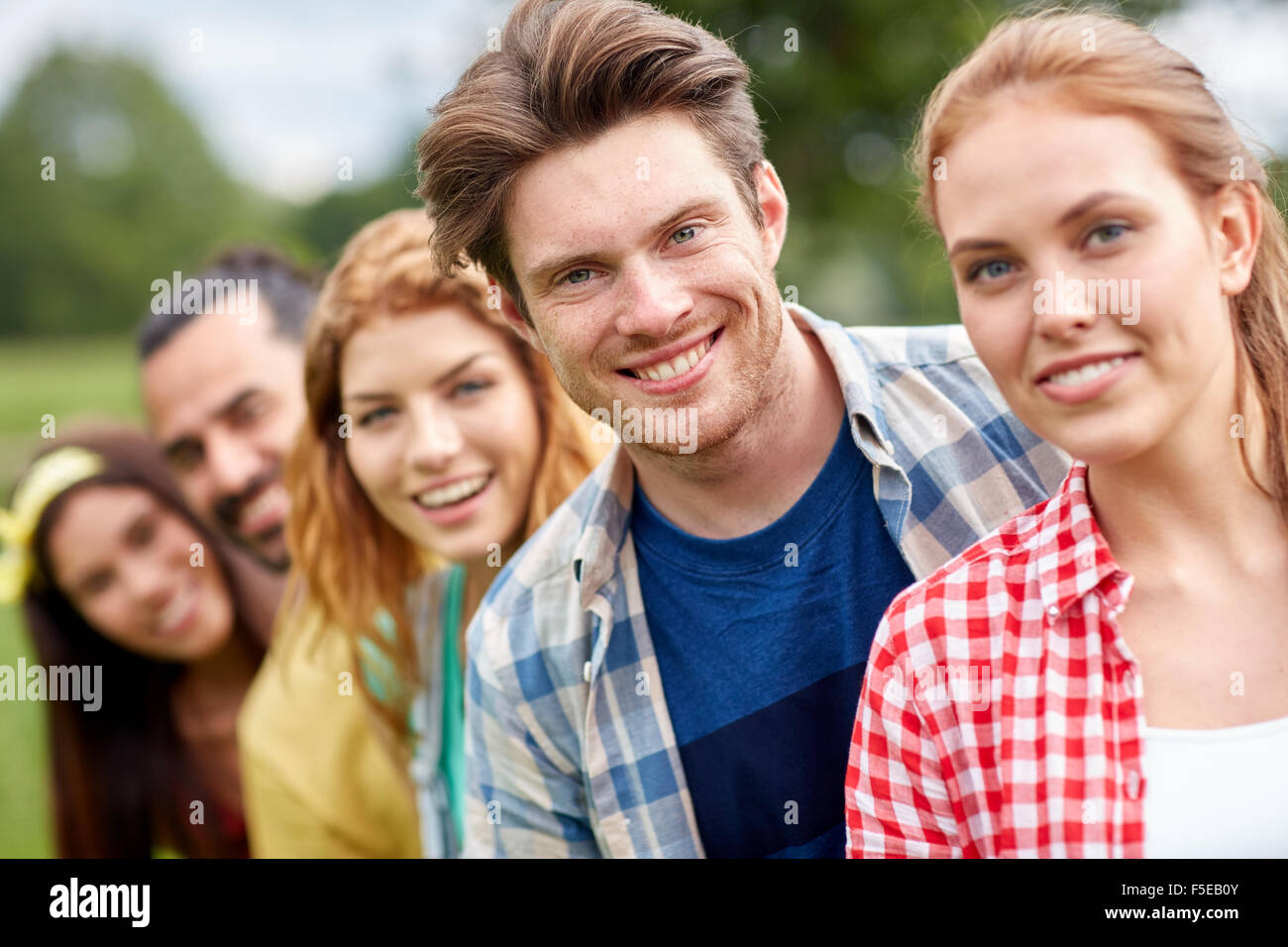 group of smiling friends outdoors Stock Photo - Alamy