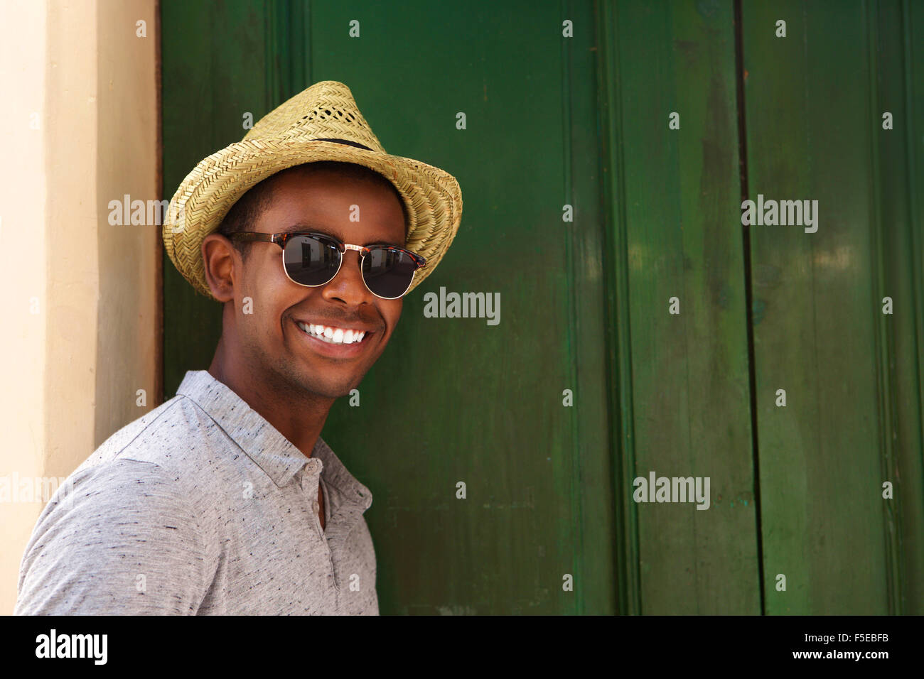 Close up portrait of a happy guy with hat and sunglasses Stock Photo ...