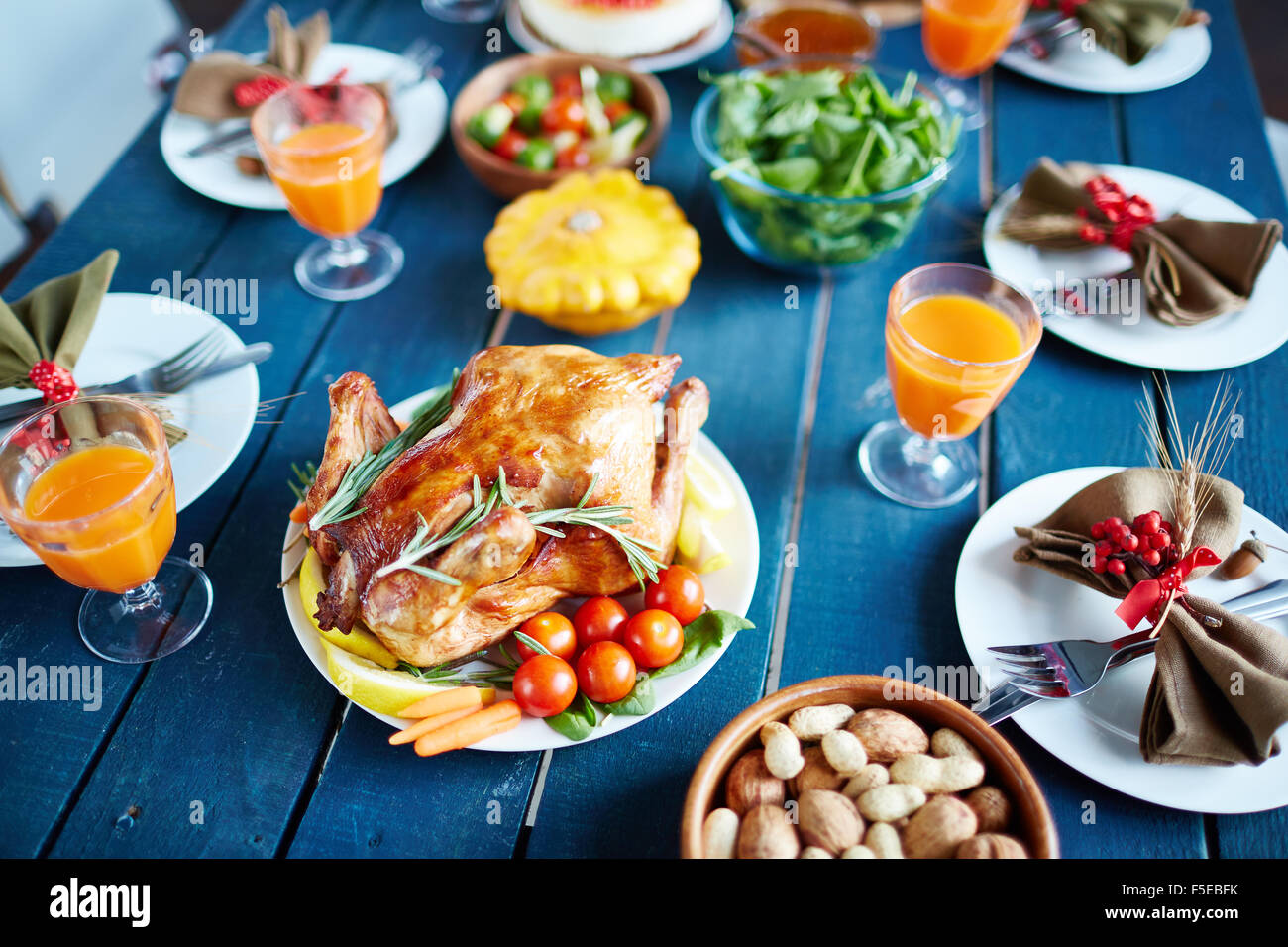 Baked turkey and other traditional Thanksgiving food on served table ...