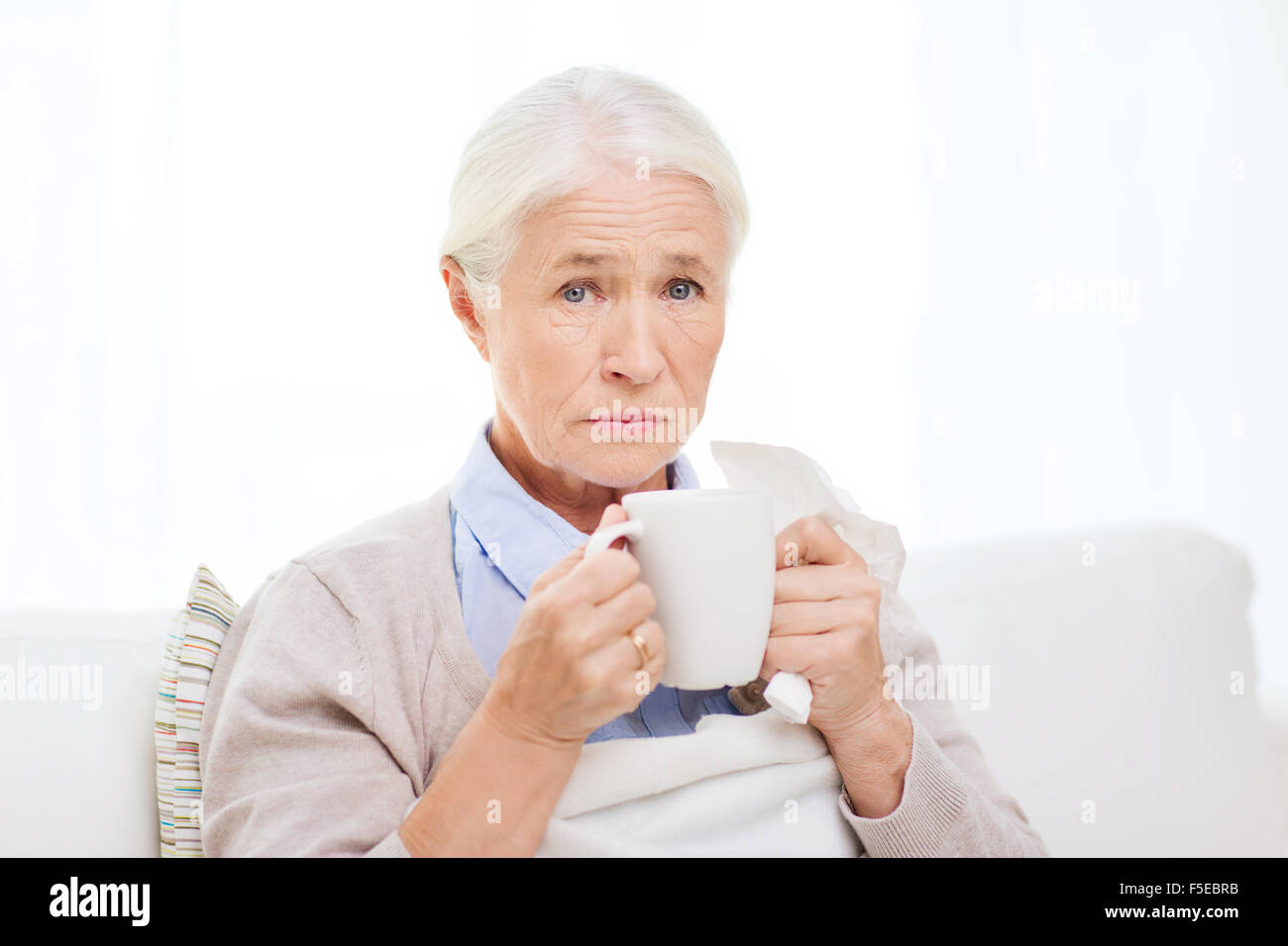 sick senior woman drinking hot tea at home Stock Photo - Alamy