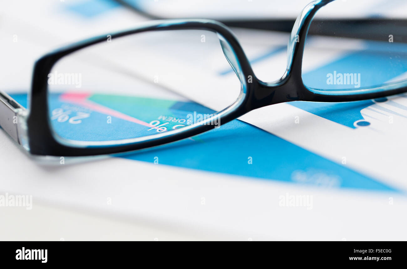 close up of eyeglasses and files on office table Stock Photo - Alamy