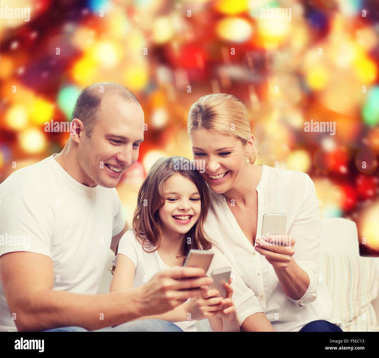 happy family with smartphones Stock Photo - Alamy