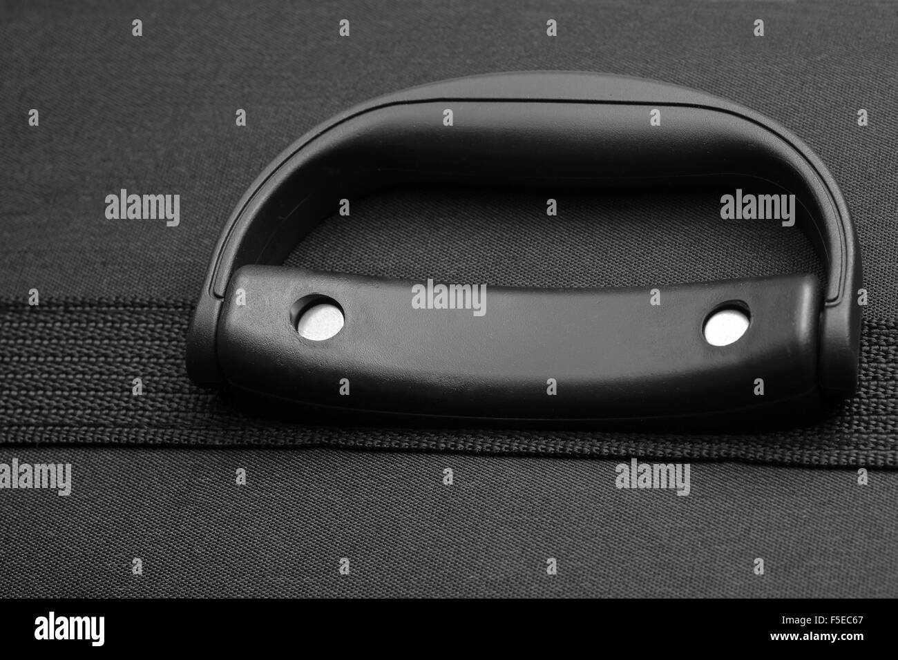 black travel suitcase handle closeup Stock Photo - Alamy