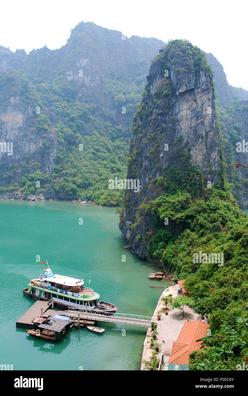 Tourist junks floating among limestone rocks at Ha Long Bay, South ...