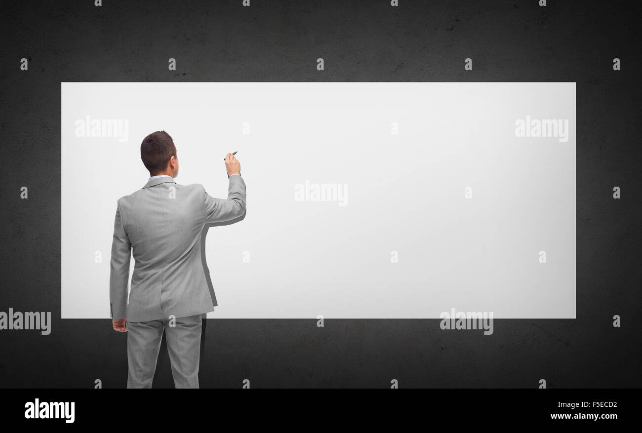 businessman writing or drawing on white board Stock Photo - Alamy