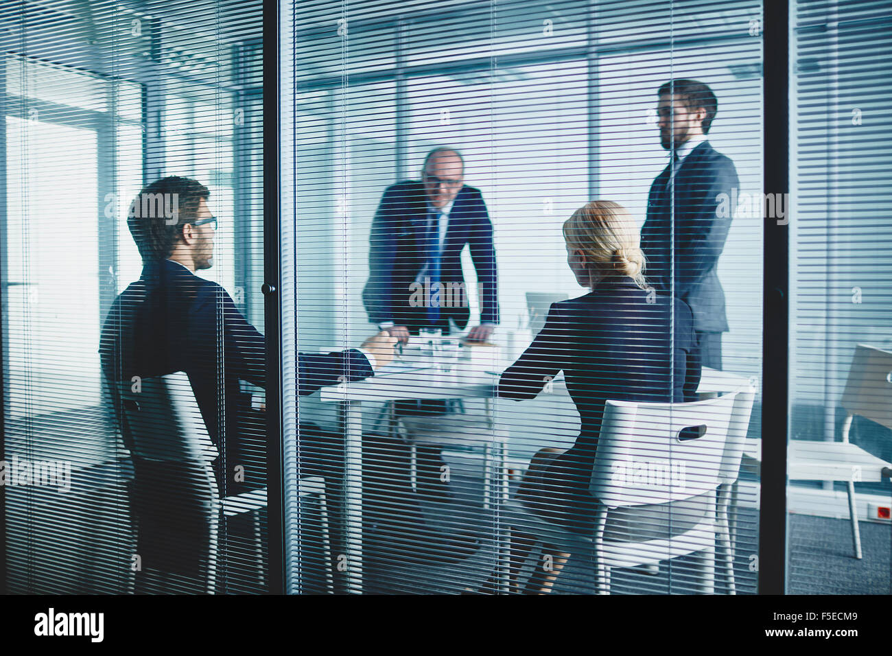 Modern managers discussing ideas and planning work in office Stock ...