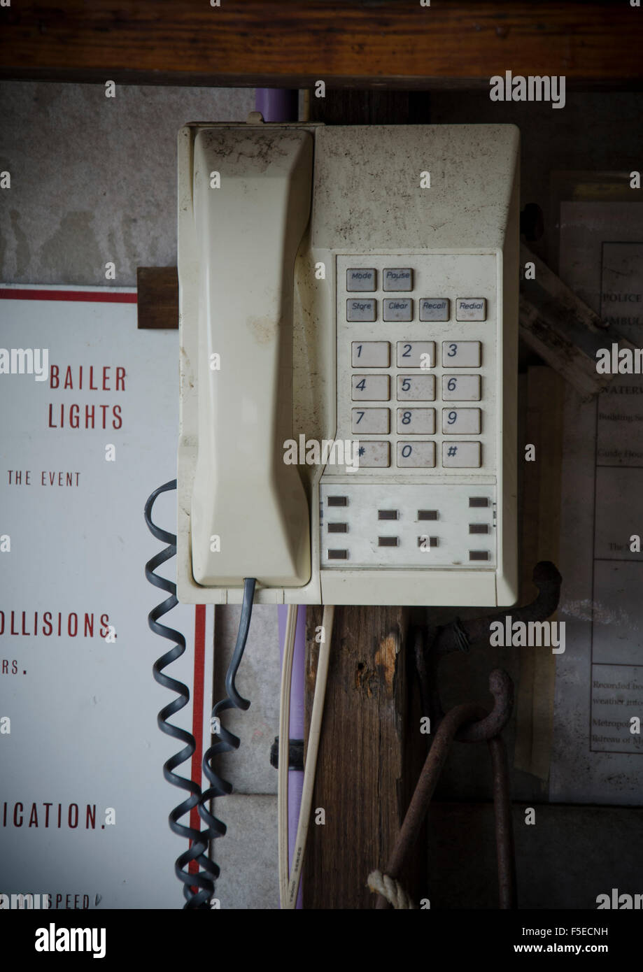 An old Telstra (Telecom Australia) digital touch phone mounted on a ...