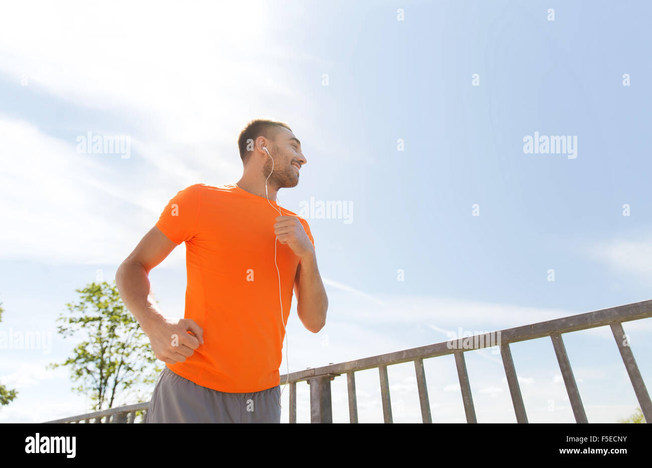Man running smiling outside hi-res stock photography and images - Alamy