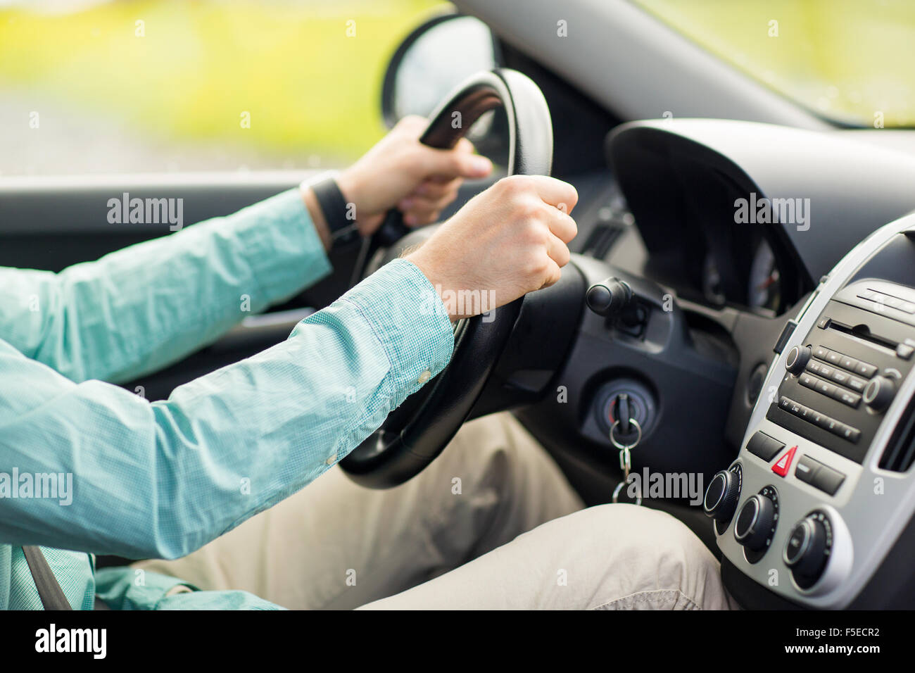 Man driving car holding hand hi-res stock photography and images - Alamy